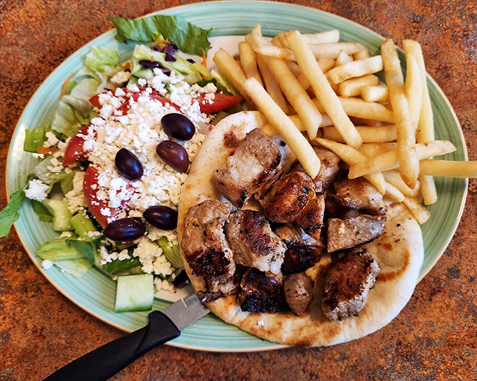 The Greek souvlaki platter brings Mediterranean sunshine to Virginia, with feta-topped salad that would make Zeus himself nod in approval.