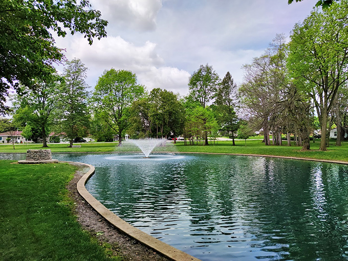 Greenville City Park's serene pond and fountain create an oasis of tranquility. The perfect spot for contemplating life&mdash;or your next meal.