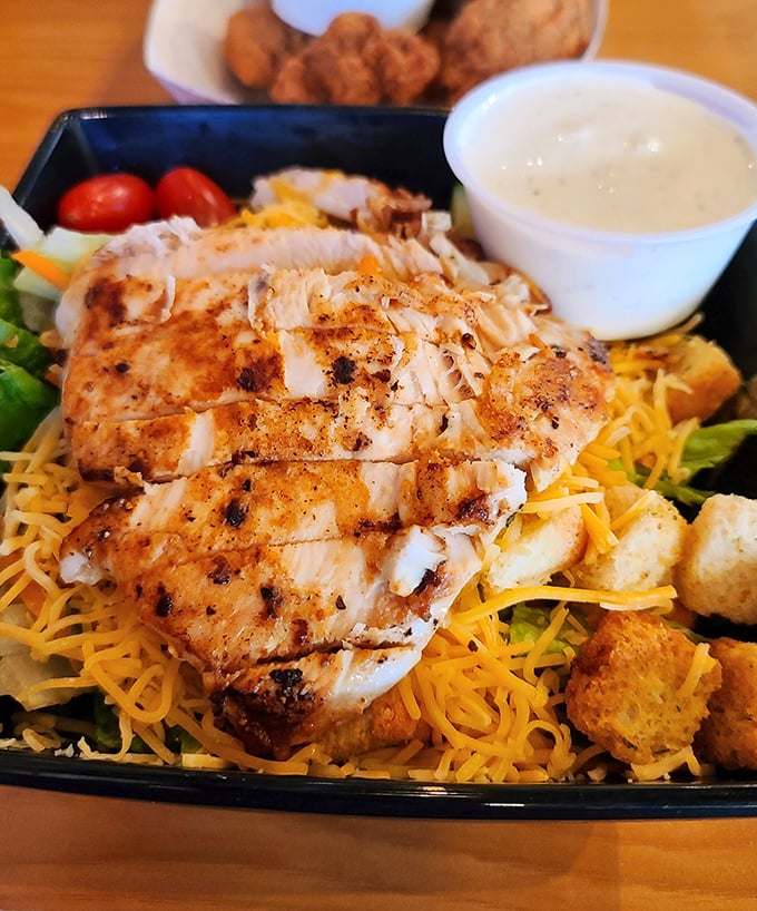 Who said salads can't be exciting? This grilled chicken masterpiece proves healthy-ish eating doesn't have to be a punishment.