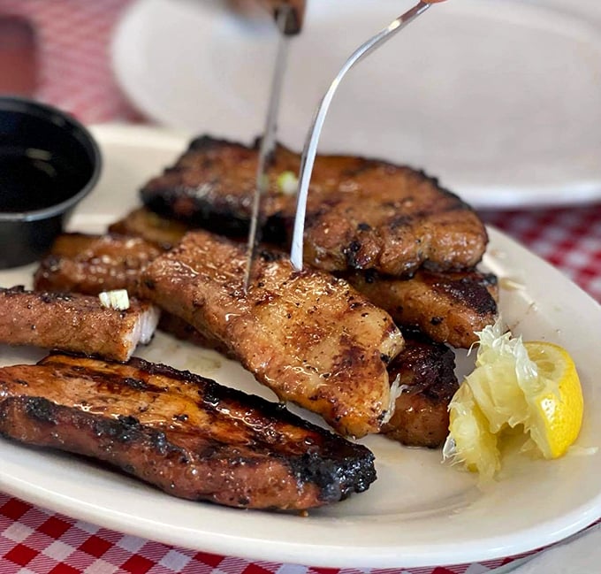 These grilled pork liempo aren't just food; they're edible postcards from Manila, complete with that perfect char that whispers "backyard cookout royalty."
