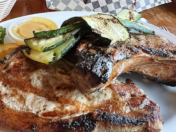 That pork chop has the kind of char that makes you want to write poetry. The grilled vegetables aren't just sidekicks&mdash;they're co-stars.