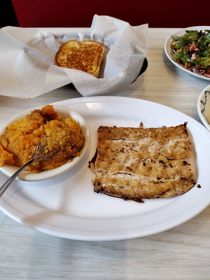 Who knew salmon could find such a happy home in a country cafe? That sweet potato casserole sidekick deserves its own fan club.