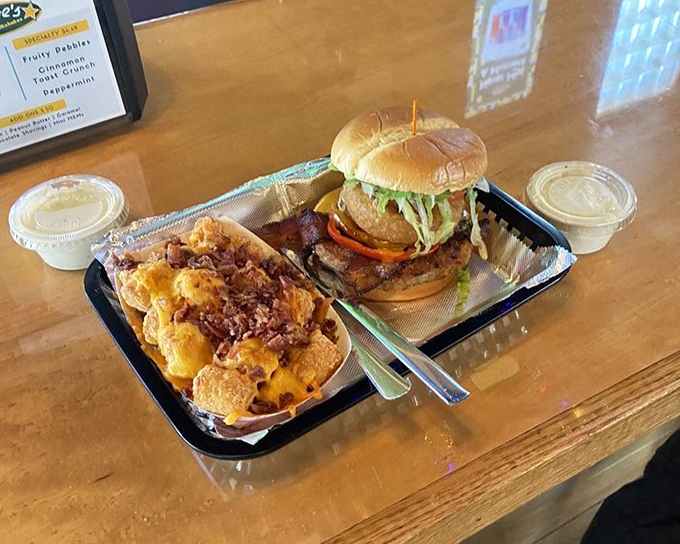 A burger and loaded fries that would make any cardiologist nervously check their appointment book. Worth every delicious calorie.