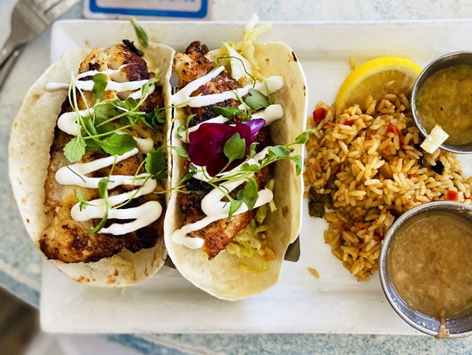 Fish tacos that make you question every taco decision you've made before. The pigeon pea rice on the side isn't playing second fiddle&mdash;it's conducting its own delicious orchestra.