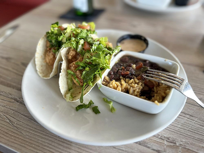 These fish tacos aren't just a meal—they're a vacation on a plate, complete with a side of Cuban-inspired rice that deserves its own fan club.