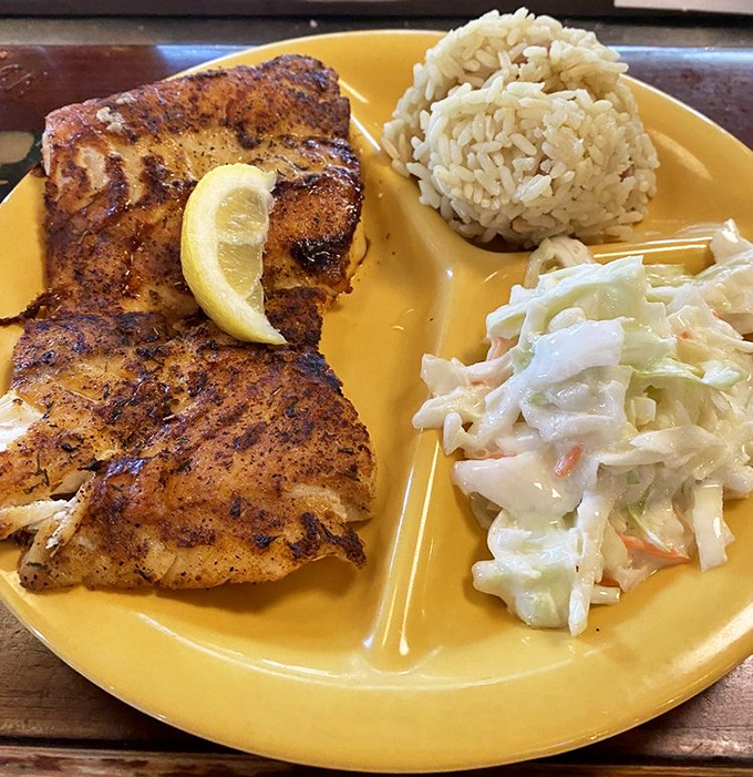 Blackened grouper that's wearing its spices like a well-earned suntan. That rice and slaw aren't just sides &ndash; they're supporting actors deserving their own applause.