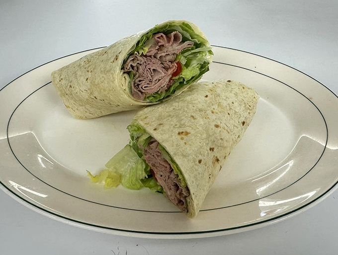 This isn't just a wrap &ndash; it's a perfectly executed gyro with tender meat, crisp lettuce, and fresh tomatoes that would make any Greek grandmother nod in approval.