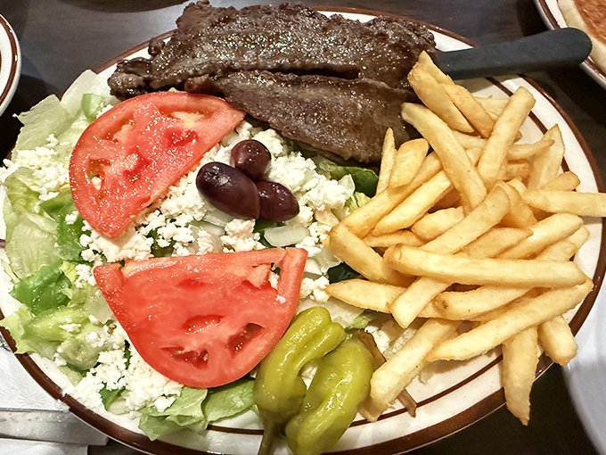 The Greek salad and gyro plate&mdash;where Mediterranean dreams meet American portions. Those feta crumbles are practically a meal themselves!