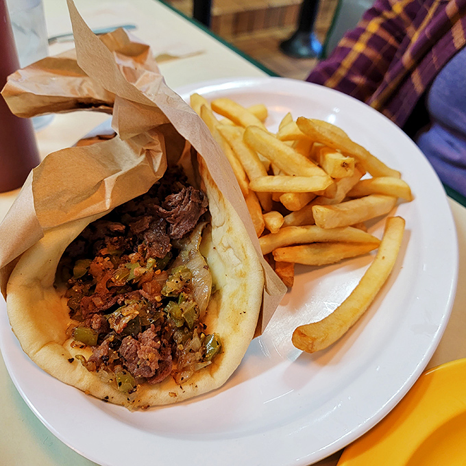 This isn't just a gyro&mdash;it's a Mediterranean hug wrapped in warm pita, with fries standing at attention nearby.