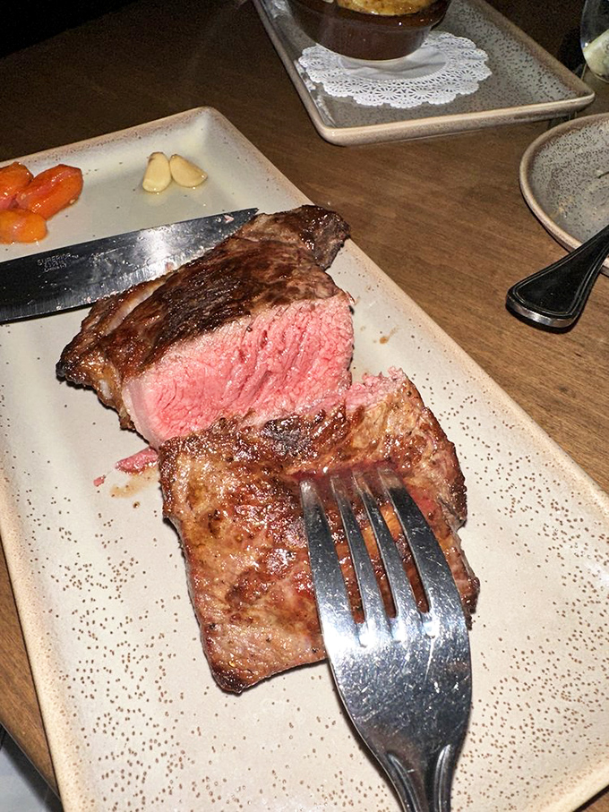 Blueberry pancakes stacked higher than your weekend ambitions &ndash; each one a fluffy canvas for maple syrup rivers.