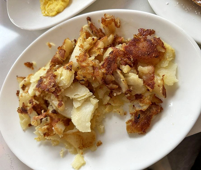 These hash browns achieved what politicians can't: the perfect balance of crispy exterior and tender interior that unites us all.