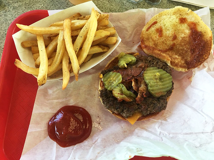 The Hickory Burger arrives with its entourage of golden fries and a dollop of ketchup standing by, ready for its moment of glory.
