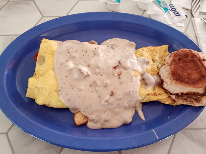 Country gravy cascading like a delicious avalanche over eggs and biscuit&mdash;resistance is futile.