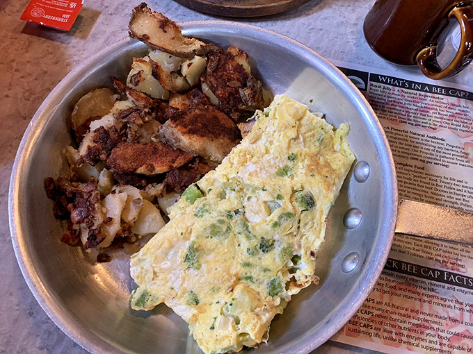 An omelet that's practically doing the backstroke in home fries&mdash;this is breakfast that understands the assignment and came prepared with extra credit.
