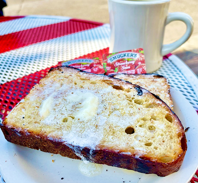 Toast so perfectly golden it belongs in Fort Knox, with butter melting like a snowman in July. Simple perfection needs no explanation.