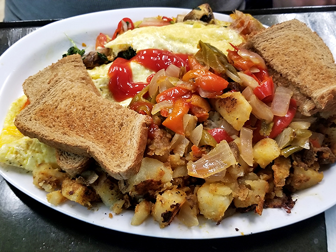 A breakfast plate so loaded with colorful vegetables, it practically qualifies as modern art with eggs.