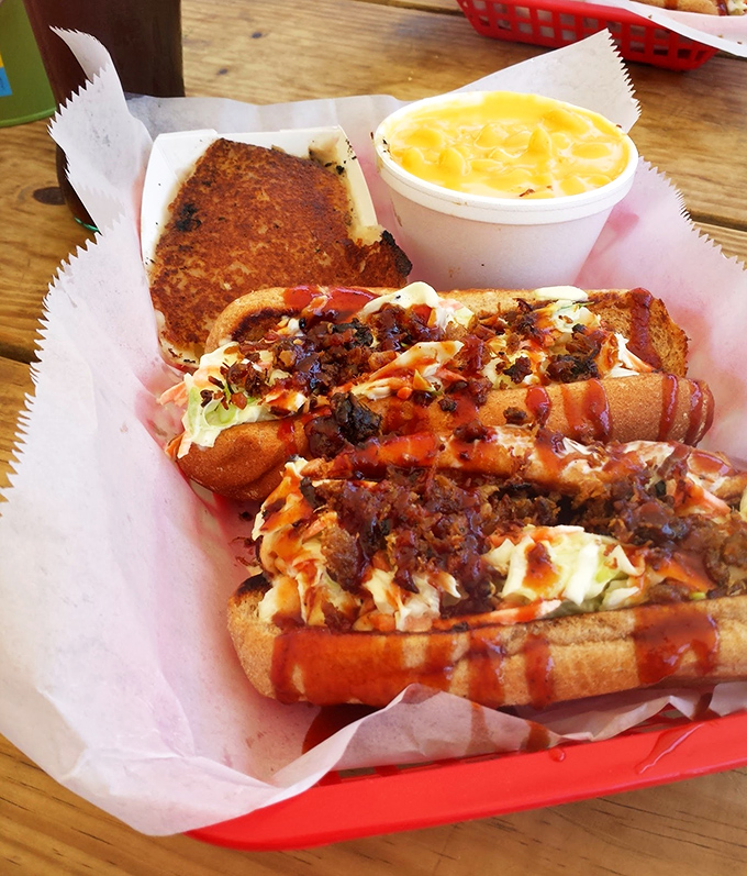 Hot dogs elevated to art form &ndash; topped with slaw, sauce, and crackling that provides the kind of crunch worth writing home about.