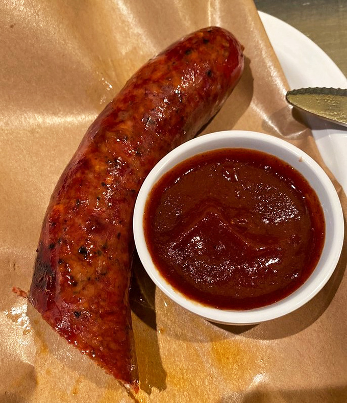 The hot link snaps with attitude when you bite into it, releasing juices that demand to be sopped up with that sauce&mdash;a perfect marriage of spice and smoke.