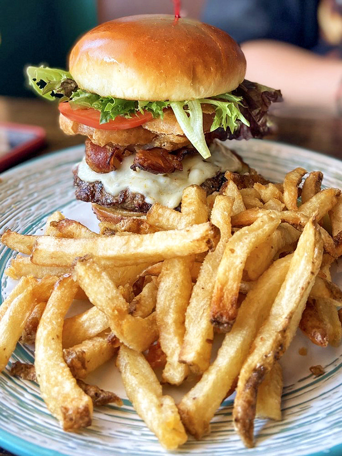 The Hot Pants Burger stands tall and proud, like the Eiffel Tower of beef, with hand-cut fries that deserve their own Instagram account.