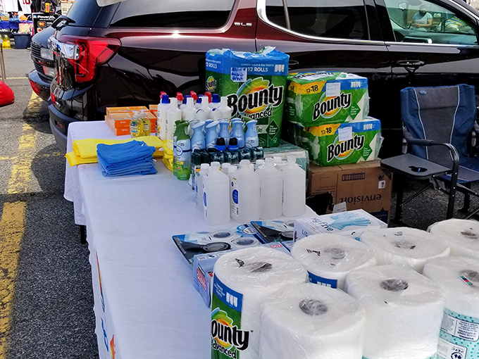 The household essentials table &ndash; where smart shoppers stock up on paper towels and cleaning supplies while their spouses hunt for vintage vinyl records.