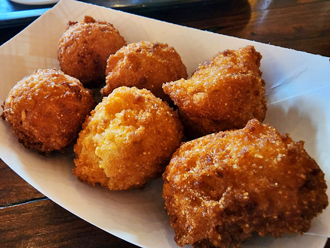 These hush puppies aren't telling tales, but they're speaking volumes about perfect frying technique with their golden-brown exteriors and fluffy centers.
