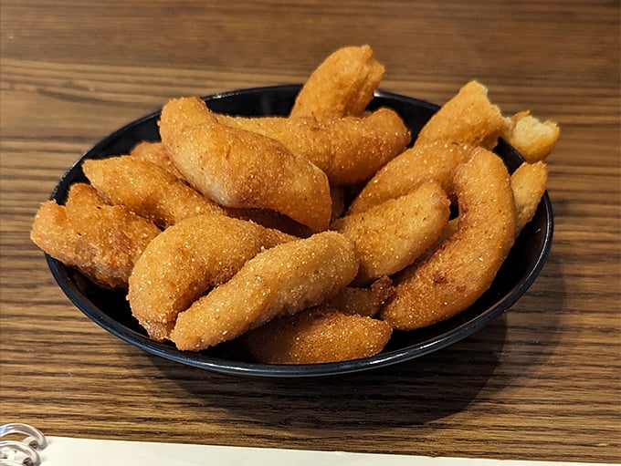 Golden-brown hush puppies that could make a Southerner weep with joy. Crispy outside, tender inside &ndash; the perfect seafood sidekick.