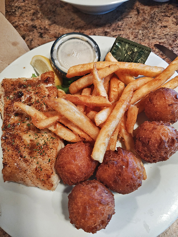 Golden-brown perfection on a plate. Those hush puppies aren't called that because they'll make you quiet&mdash;they'll have you howling with delight.