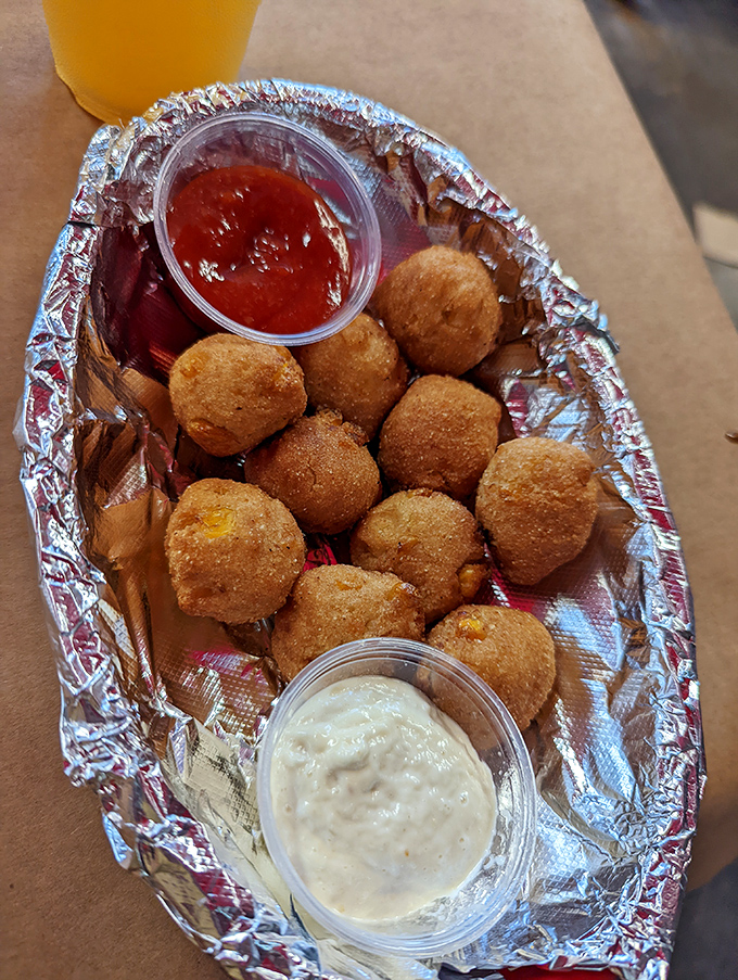Golden-fried hush puppies&mdash;those little cornmeal spheres of joy that somehow make waiting for your crabs feel like a reward, not a punishment.