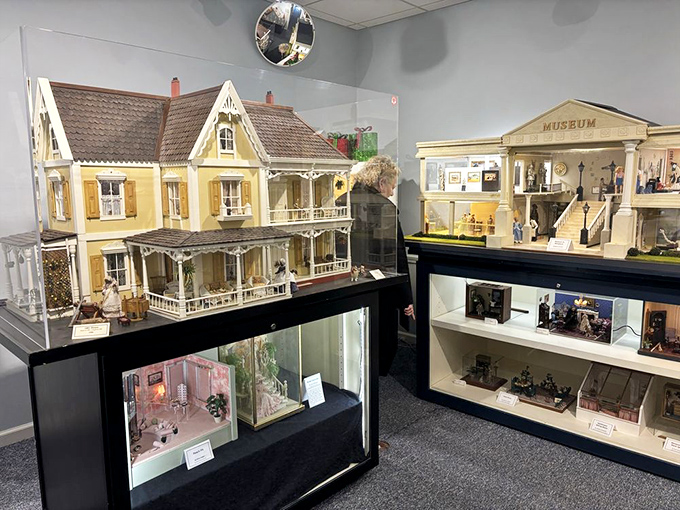 Victorian elegance meets meticulous craftsmanship in these display cases, where entire neighborhoods exist under glass, waiting for your wide-eyed inspection.