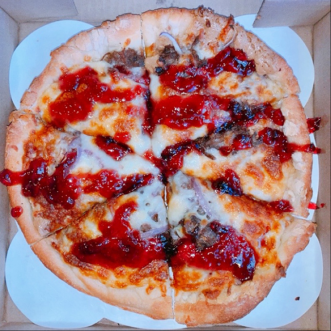 What happens when meat, sauce, and cheese have a party on a perfectly baked crust? This pizza happens, and everyone's invited.