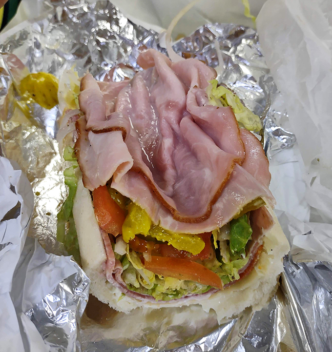 The Italian hoagie arrives like edible architecture&mdash;layers of quality meats, crisp vegetables, and sharp provolone creating a symphony of flavors in every mouthful.