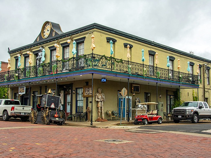 The Jefferson Hotel stands like a yellow beacon of Southern hospitality, complete with wrought-iron balconies for proper people-watching.