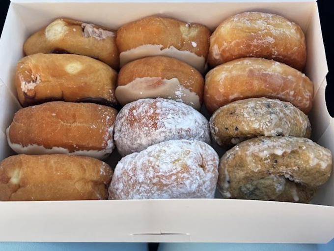 A dozen reasons to smile packed neatly in a box&mdash;from classic glazed to powdered sugar that'll inevitably end up on your shirt. Worth it.