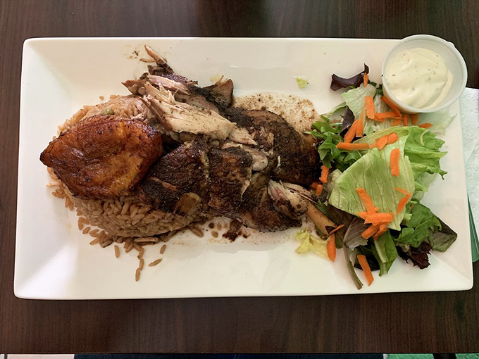 Jerk chicken so authentic it should come with its own passport. The blackened exterior hides juicy meat that's had a proper conversation with spices.