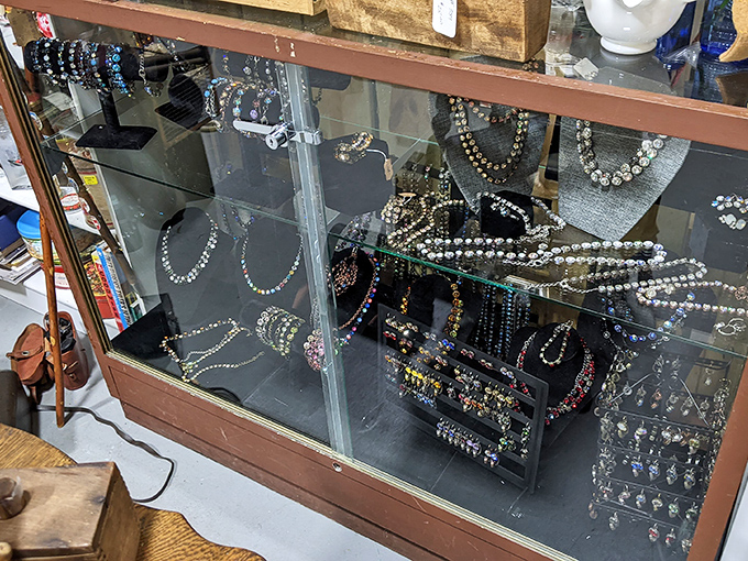 Sparkle central: Vintage costume jewelry awaits new life in these glass cases. That rhinestone necklace? Definitely starred in someone's prom night circa 1962.