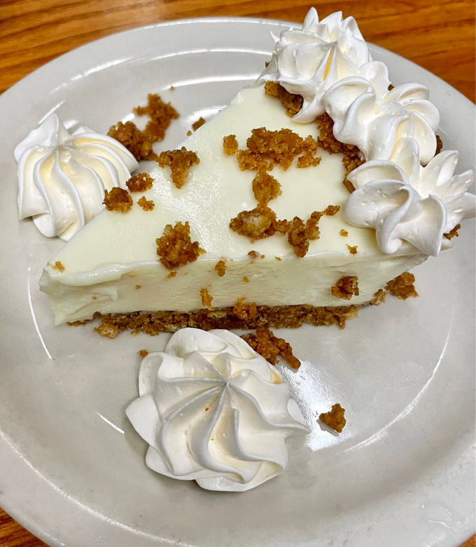 Key lime pie that strikes the perfect balance between sweet and tart, topped with whipped cream islands and a graham cracker archipelago.
