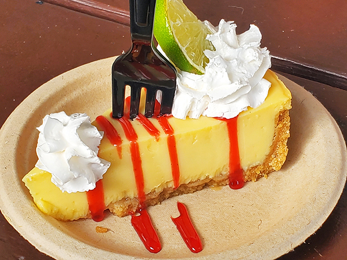 Key lime pie with a crimson drizzle and lime garnish. Florida's official dessert gets the respect it deserves here.
