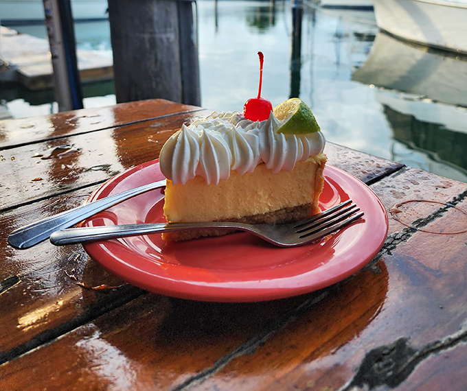 Key lime pie with a view – this slice has the perfect pucker-to-sweet ratio, topped with a dollop of whipped cream that's practically begging for a selfie.