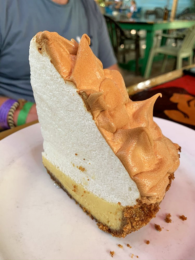 That towering slice of Key lime pie with its cloud-like meringue proves that sometimes the best desserts are worth the inevitable food coma.