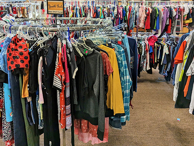 The youth section isn't just clothing&mdash;it's potential Halloween costumes, school play outfits, and growth spurt solutions all hanging in harmonious chaos.