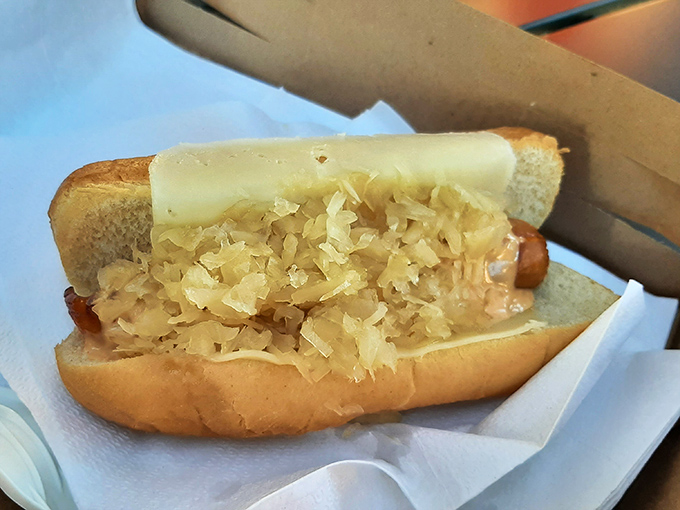 The Kraut Dog: where tangy sauerkraut meets juicy frankfurter in a marriage that would make any German grandmother nod in approval.