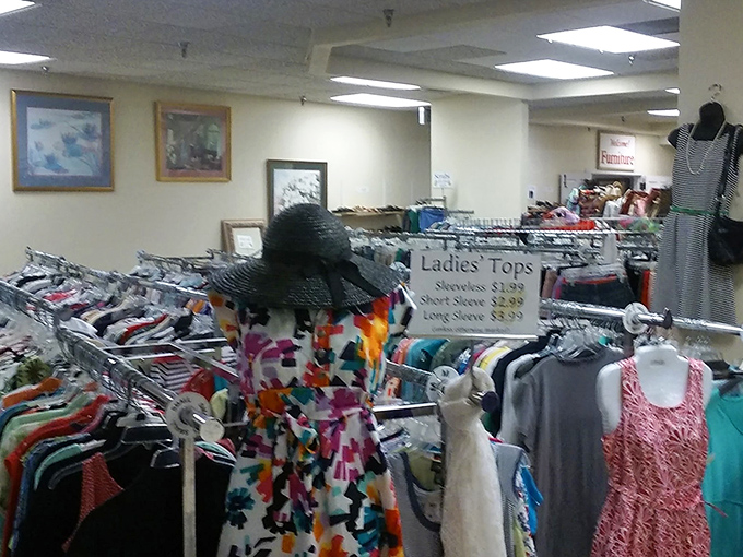 The ladies' tops section &ndash; where vintage florals and contemporary cuts create a fashion timeline spanning decades of style evolution. 