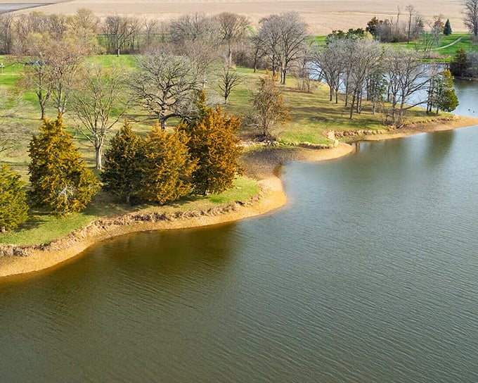 Lake Storey Park offers the kind of serene water views that usually require a second mortgage or a timeshare presentation, but here they're just part of daily life.