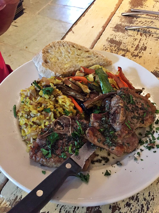 When lamb chops are plated this beautifully, you know you're not at your nephew's backyard barbecue anymore. That knife means business.