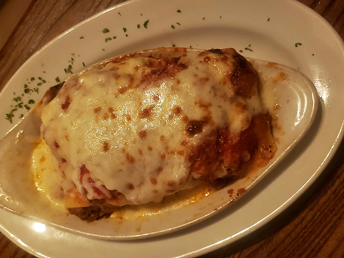 Beneath that golden, bubbling cheese blanket lies a lasagna so comforting it could end family feuds and broker peace treaties.