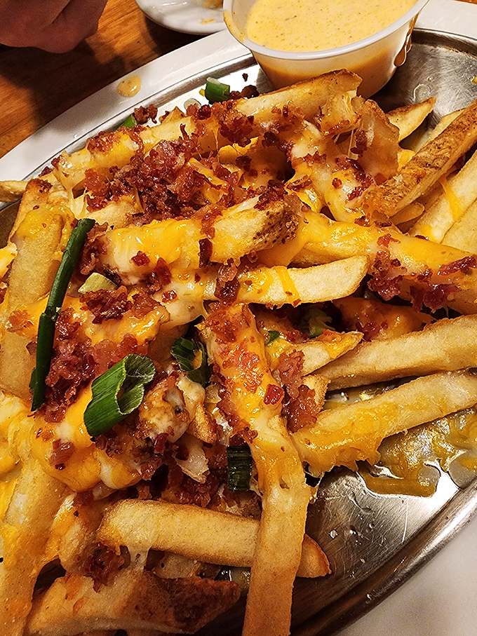 These loaded fries aren't just a side &ndash; they're a main event, with bacon and cheese creating the kind of indulgence that makes your cardiologist wince and your taste buds applaud.