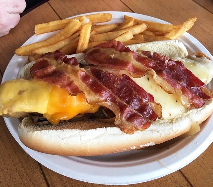 Not just any hot dog &ndash; this is architectural achievement in sandwich form. Bacon, cheese, and toppings stacked with the ambition of a Florida condo developer.