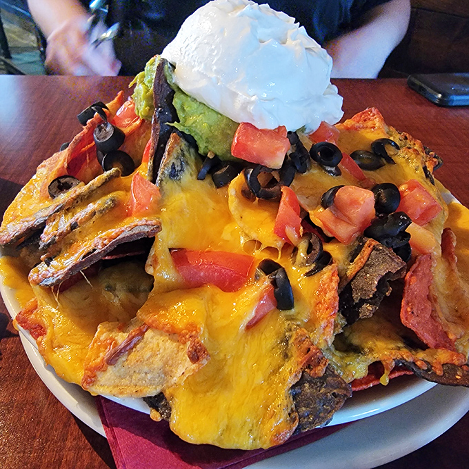 These nachos aren't just loaded &ndash; they're having an existential crisis under the weight of all that cheese, guacamole, and happiness.