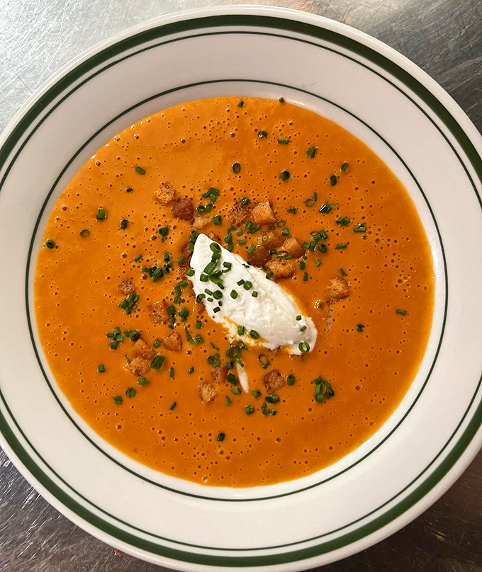 Manhattan clam chowder gets the star treatment with a dollop of cream and fresh herbs&mdash;tomato-based brilliance that would make even die-hard New Englanders reconsider their loyalties.