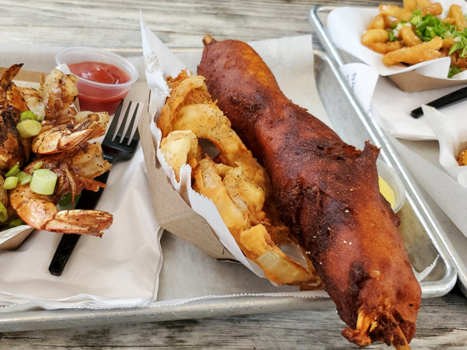 The Lobster Corn Dog defies culinary logic yet makes perfect sense once tasted. State fair meets fine dining in one glorious hand-held masterpiece.
